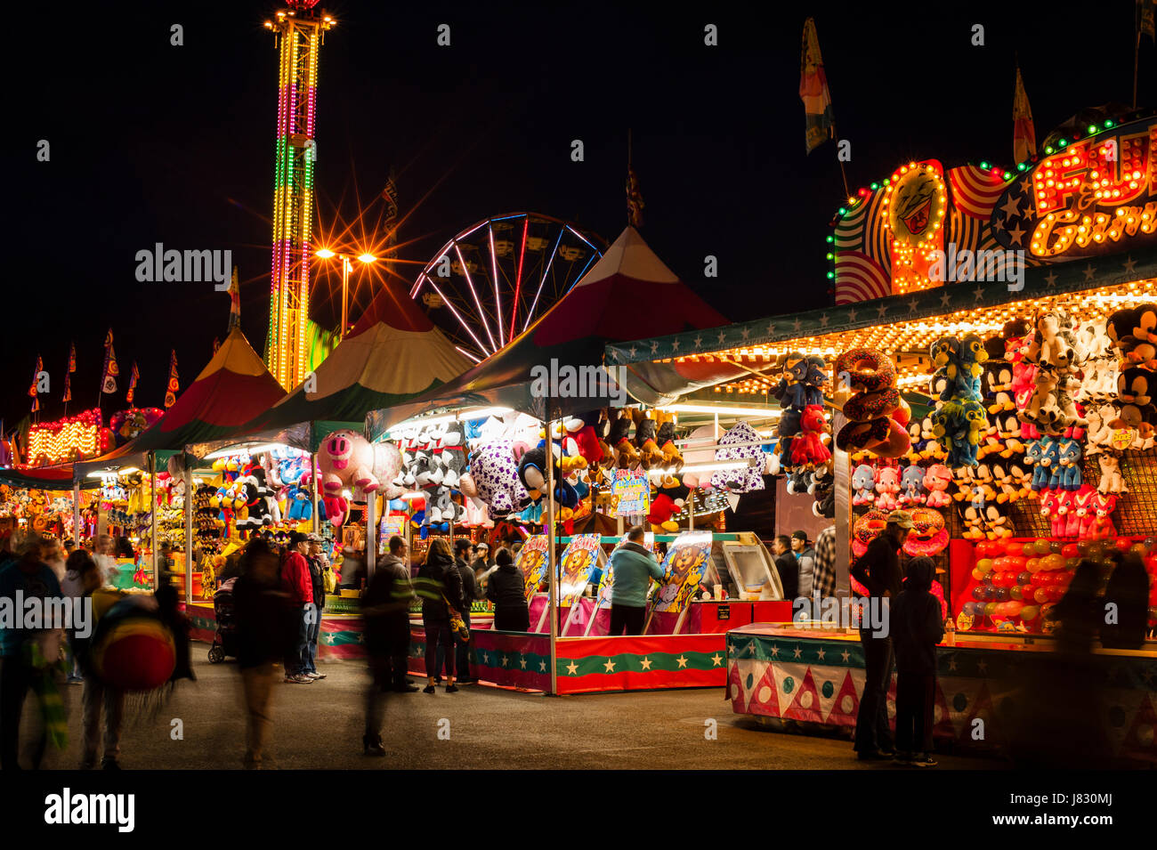 Evergreen State Fair at twilight with game booths at night Monroe ...