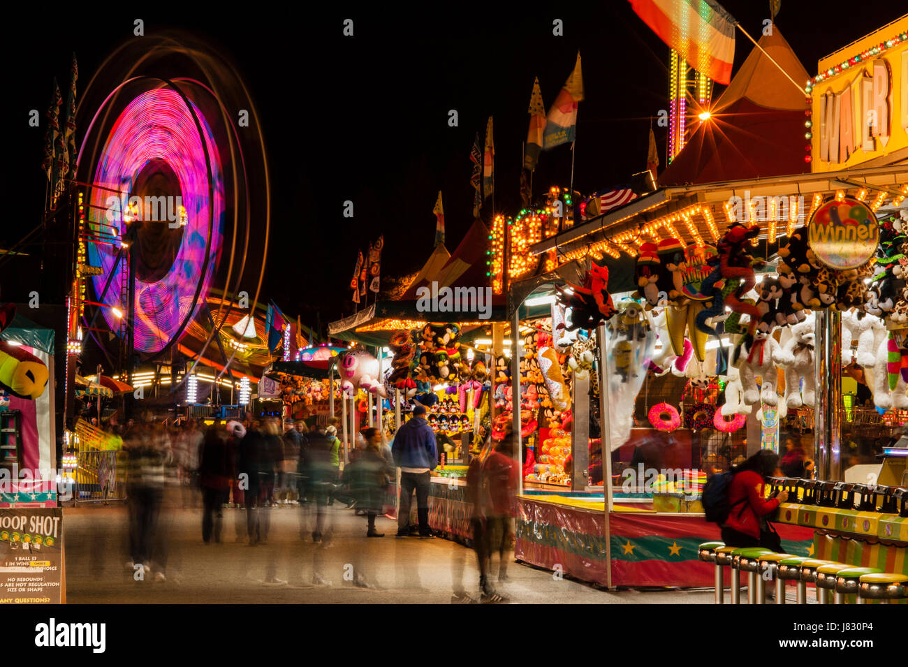 Evergreen State Fair at twilight with game booths at night Monroe ...