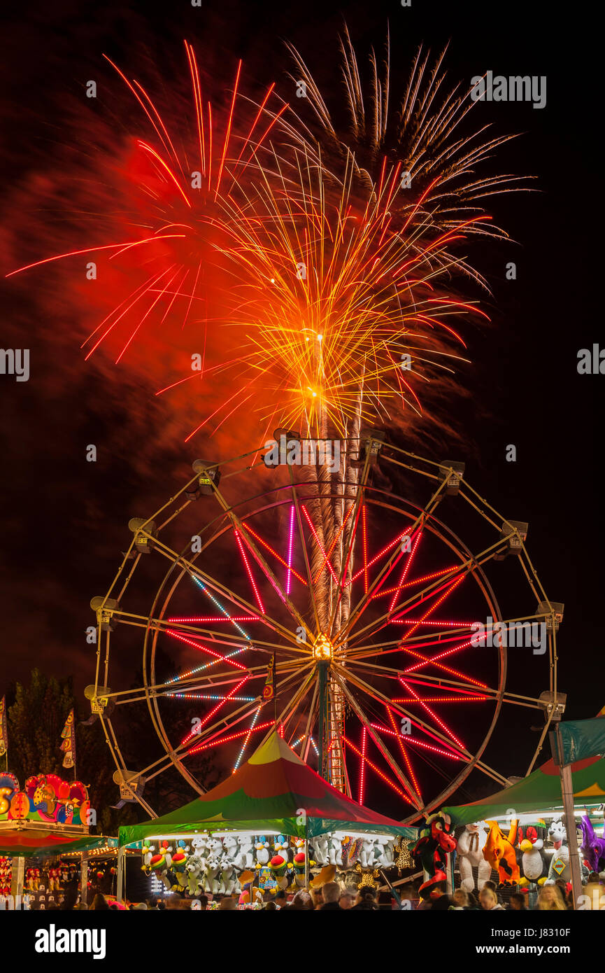 Evergreen State Fair fireworks display with ferris wheel and game ...