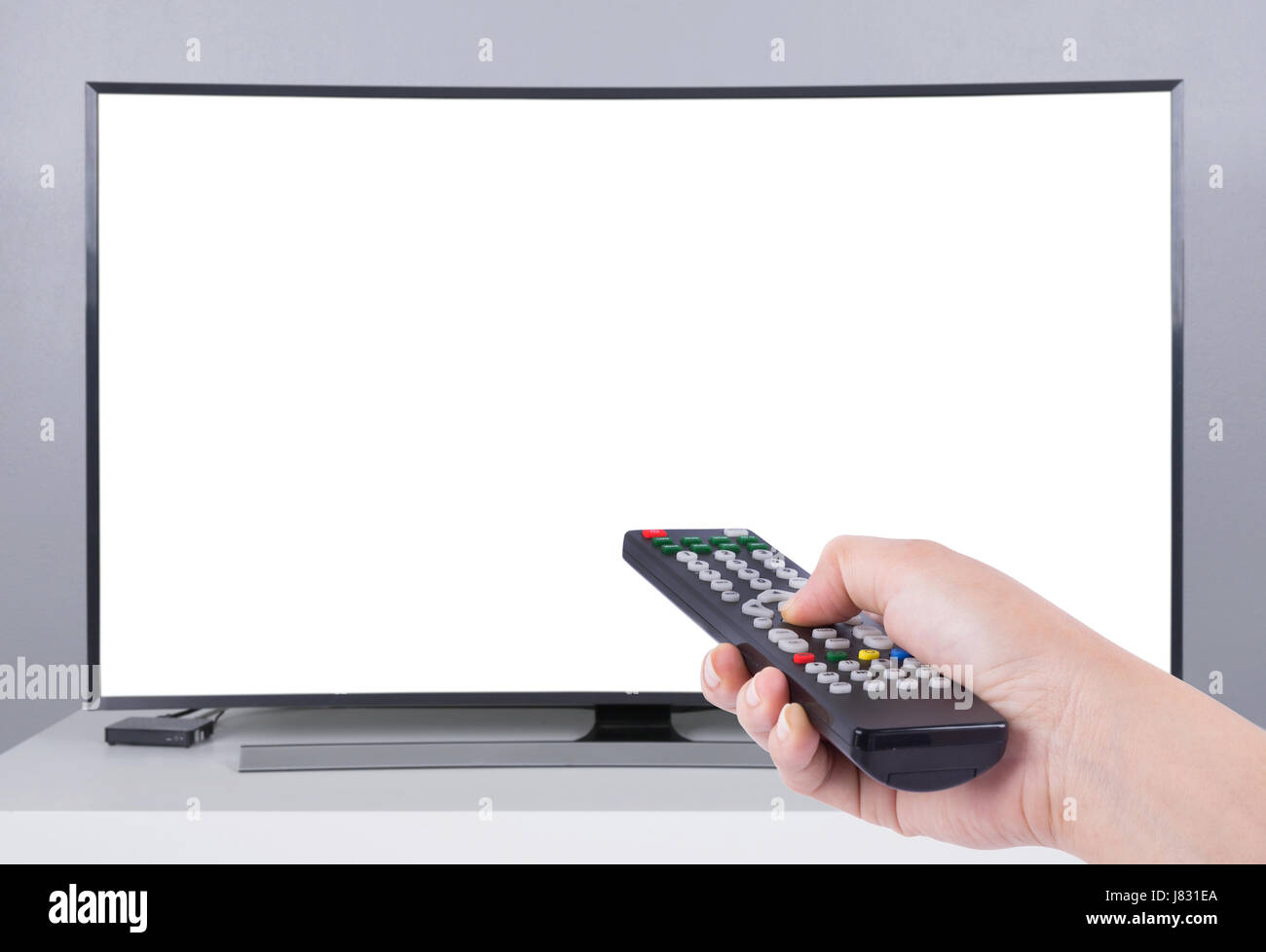 Hand holding TV remote control with LED TV and white blank screen Stock ...