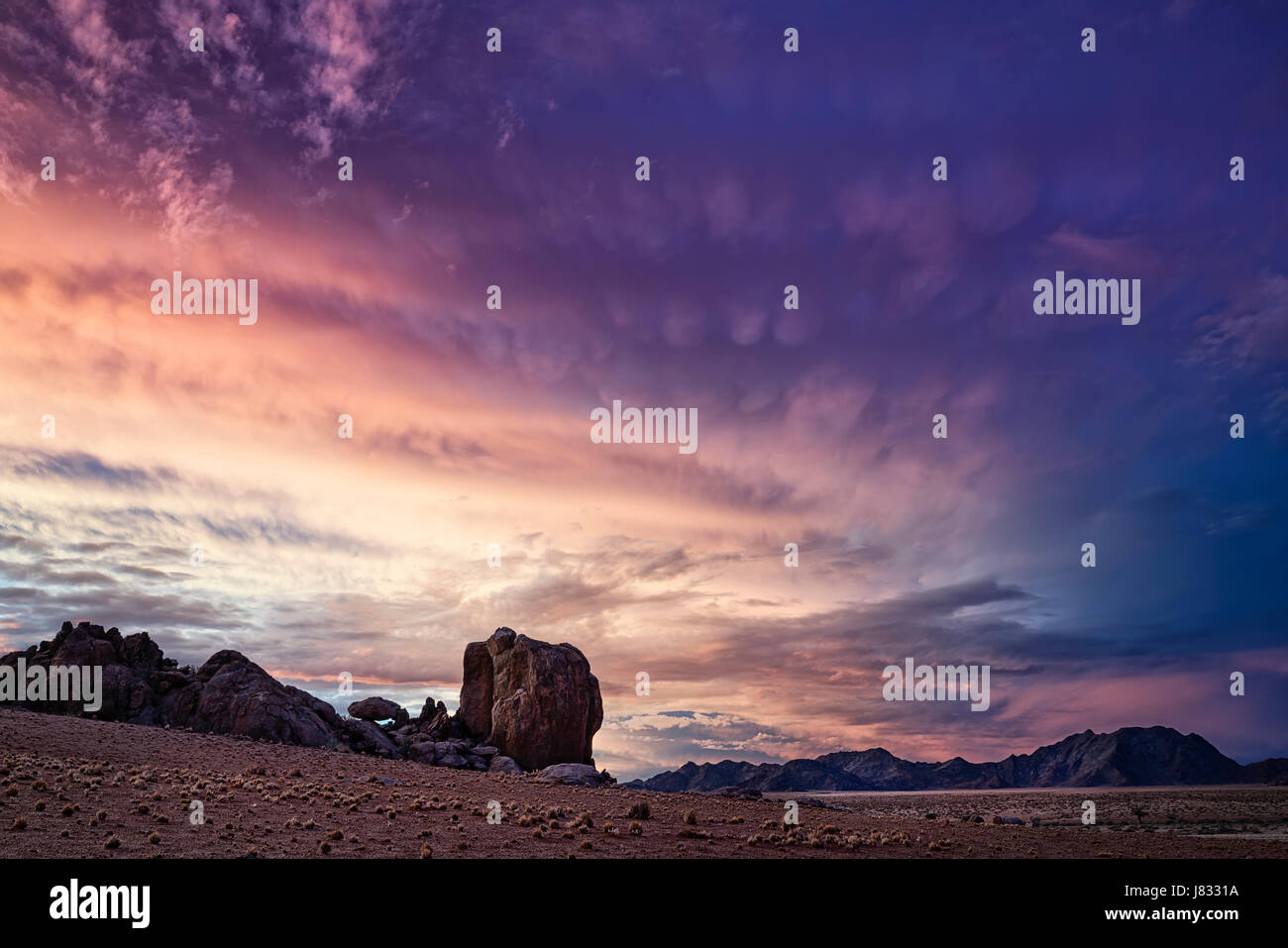 Desert rock dusk Stock Photo - Alamy