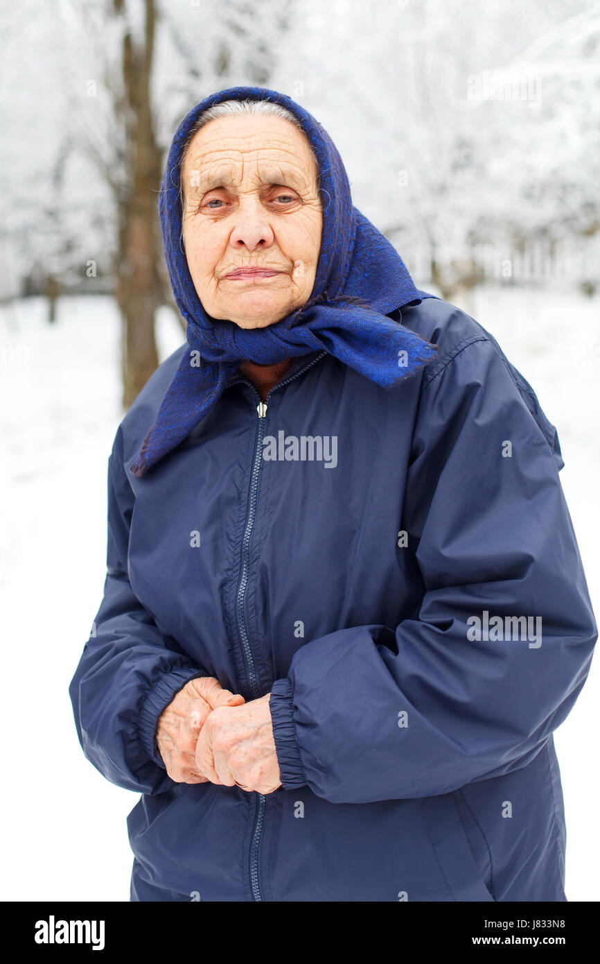 Portrait of an old retired woman on wintertime Stock Photo - Alamy