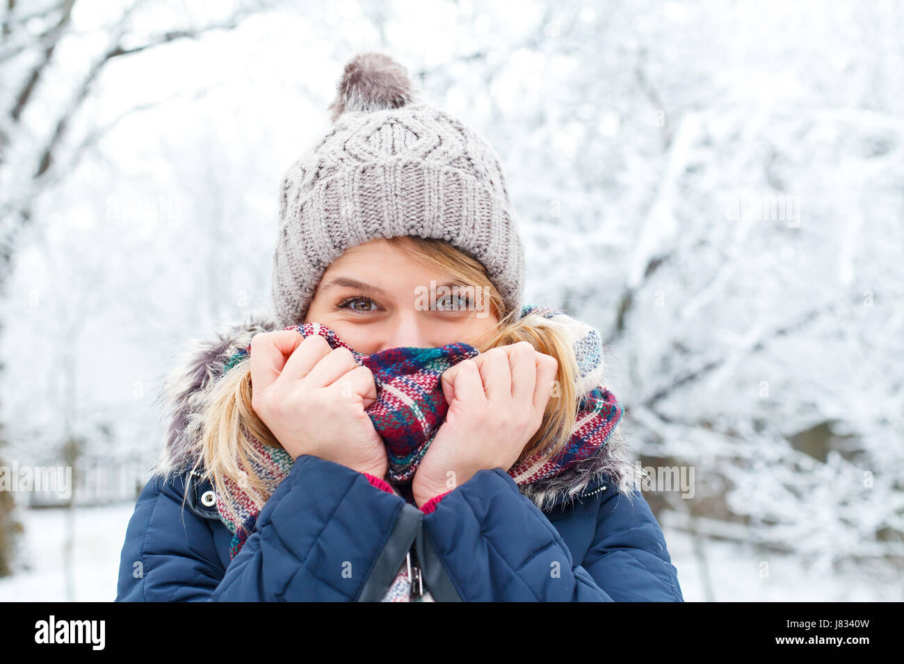 Picture of a young woman feeling cold on wintertime Stock Photo - Alamy