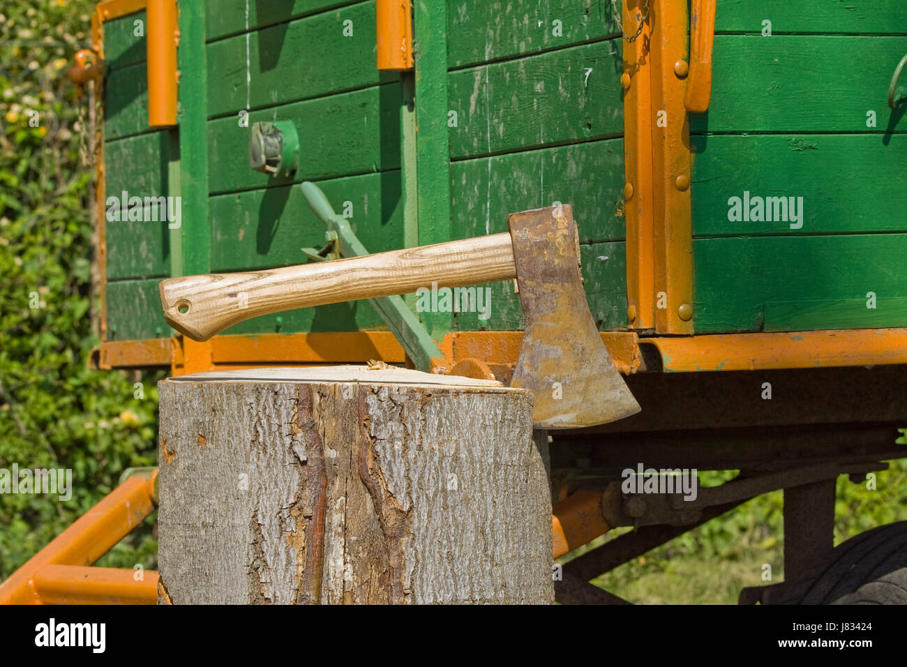 axe in a block of wood Stock Photo - Alamy