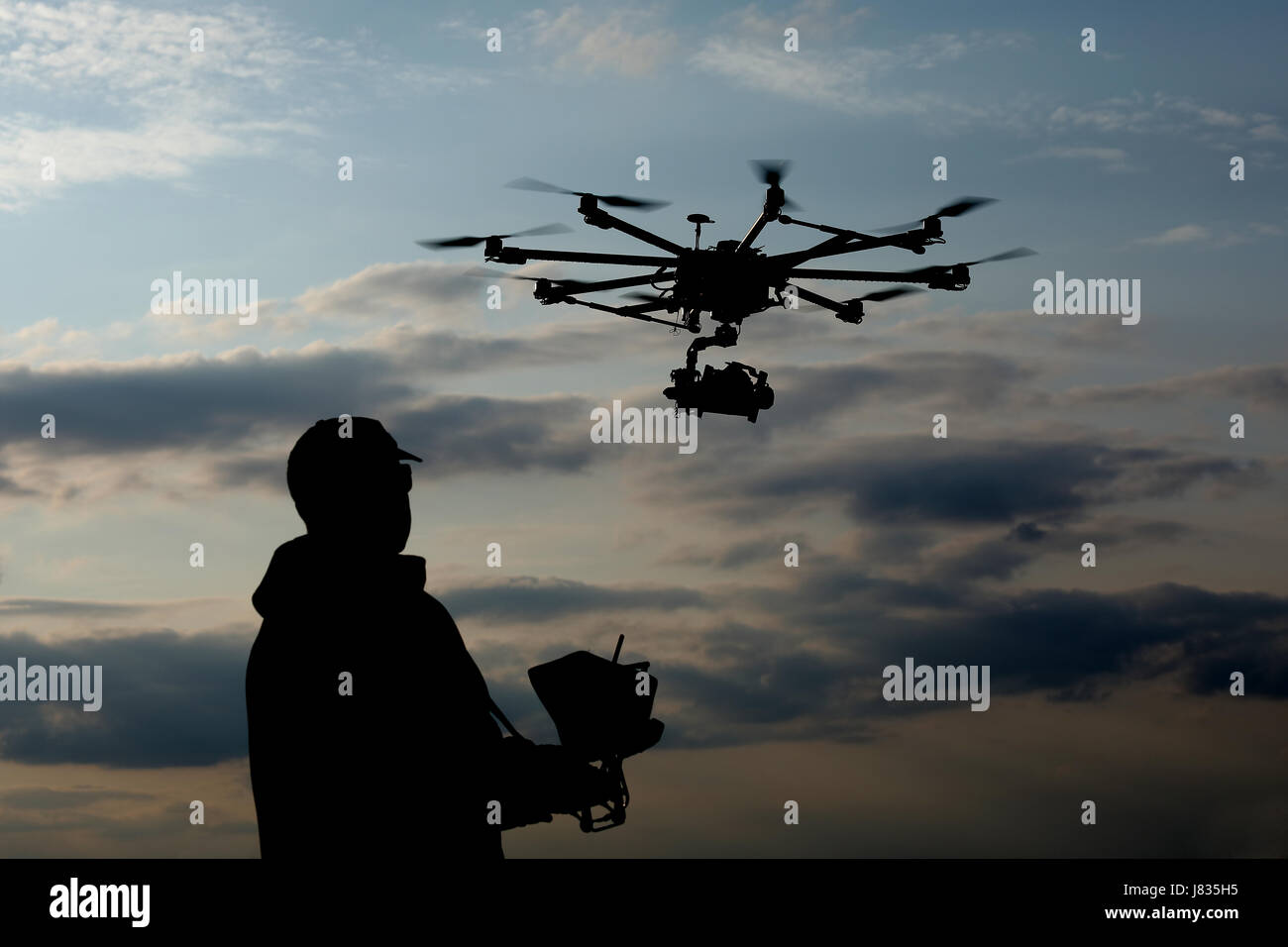 Drone, Unmanned copter flight, pilot flying drone Stock Photo - Alamy