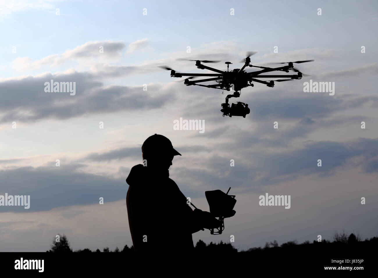 Drone, Unmanned copter flight, pilot flying drone Stock Photo - Alamy