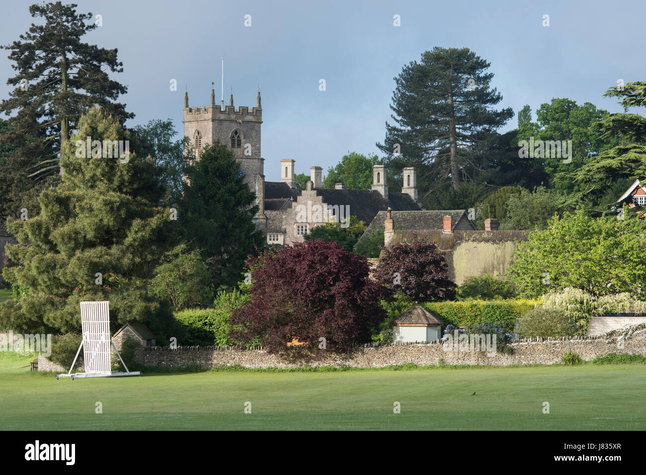 Combe village with St Laurence church tower in the early morning. Combe ...