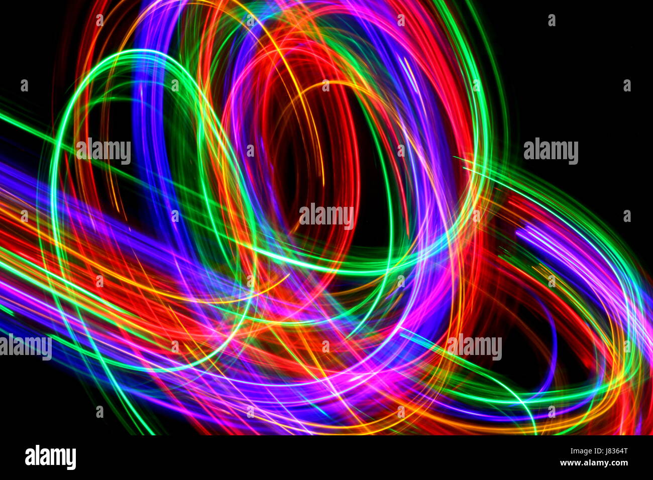 Multi Coloured Light Painting Photography, swirls and loops against a ...