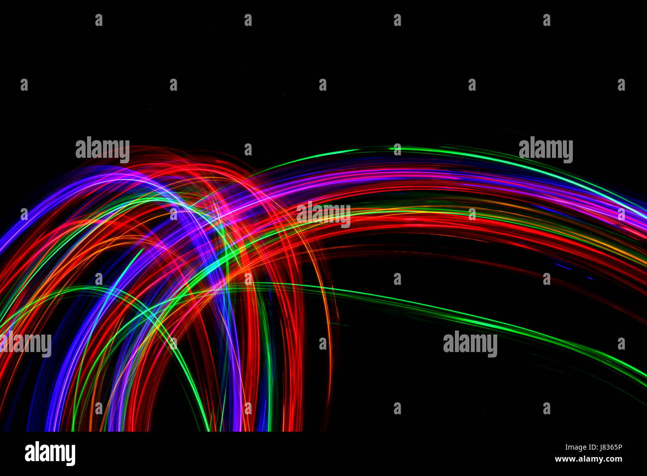 Multi Coloured Light Painting Photography, swirls and loops against a ...