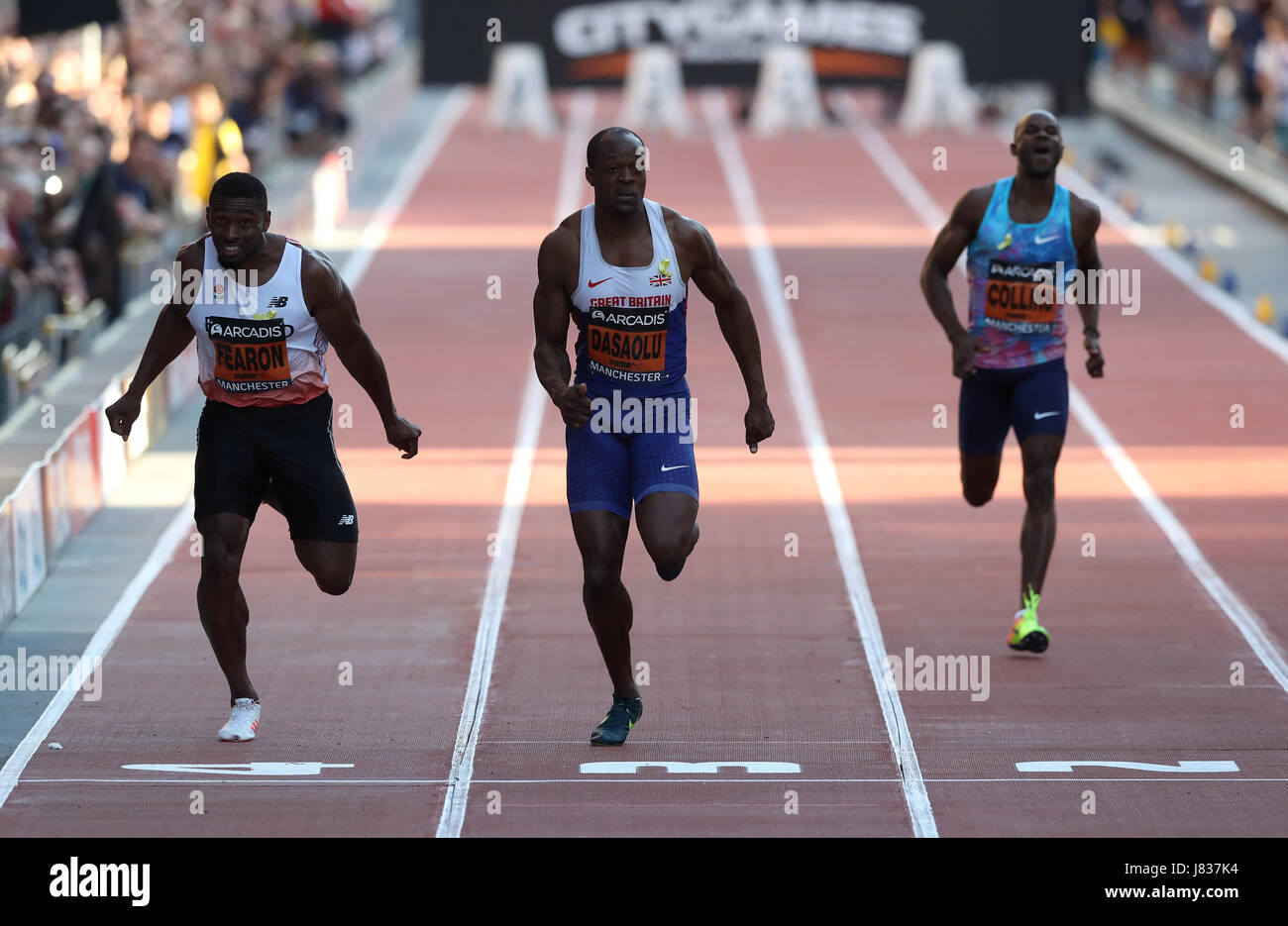 James Dasaolu (centre ) before winning the Men's 100m ahead of (left ...