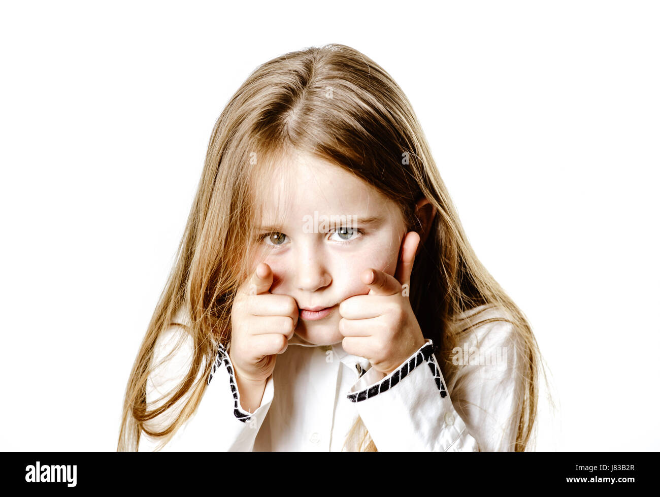 Cute little girl posing for advertising, making signes by hands and ...