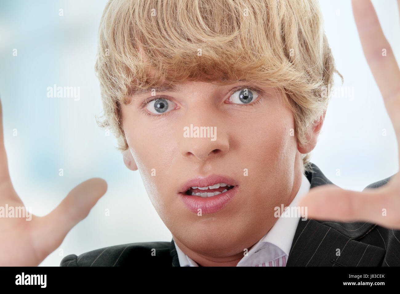 single male masculine face portrait person panic fear adult standing ...