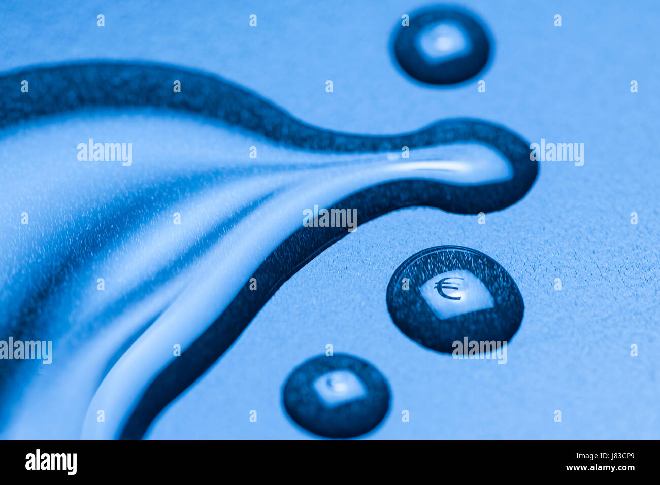 A larger cropped liquid drop and several smaller ones with mirrored ...