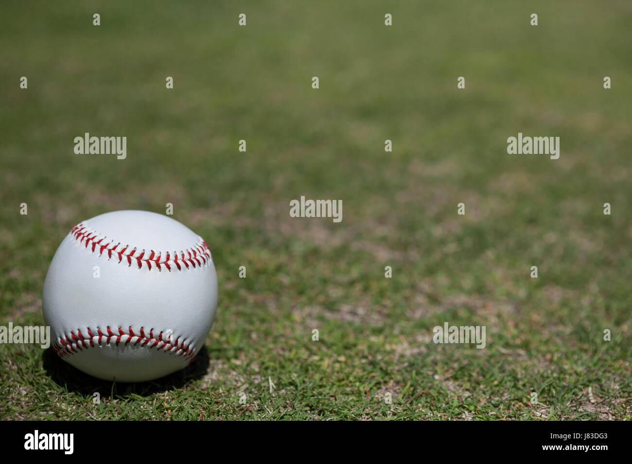 Close-up of ball on baseball field Stock Photo - Alamy