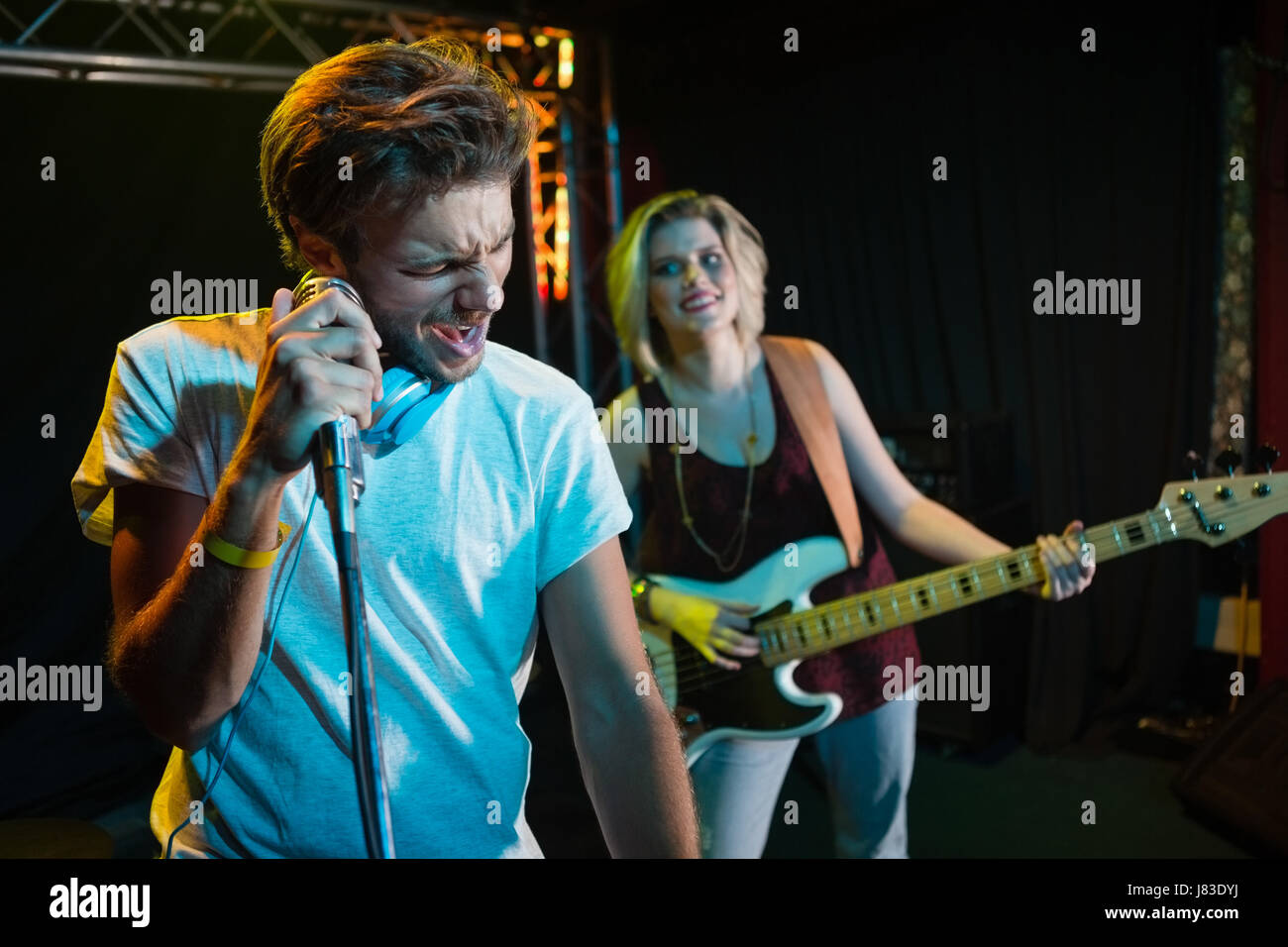 Band performing on stage in nightclub Stock Photo - Alamy