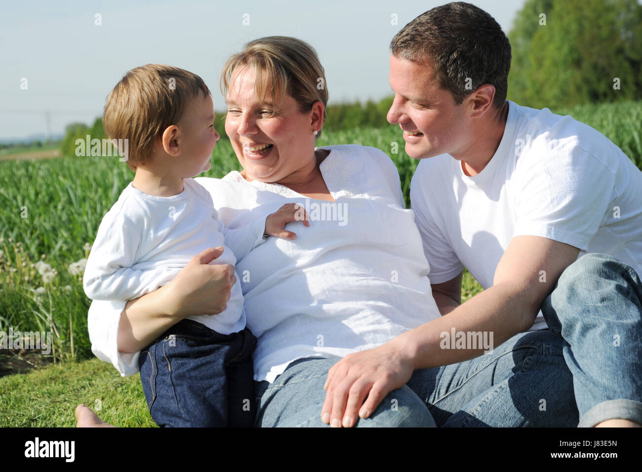 happy young family with infant Stock Photo - Alamy