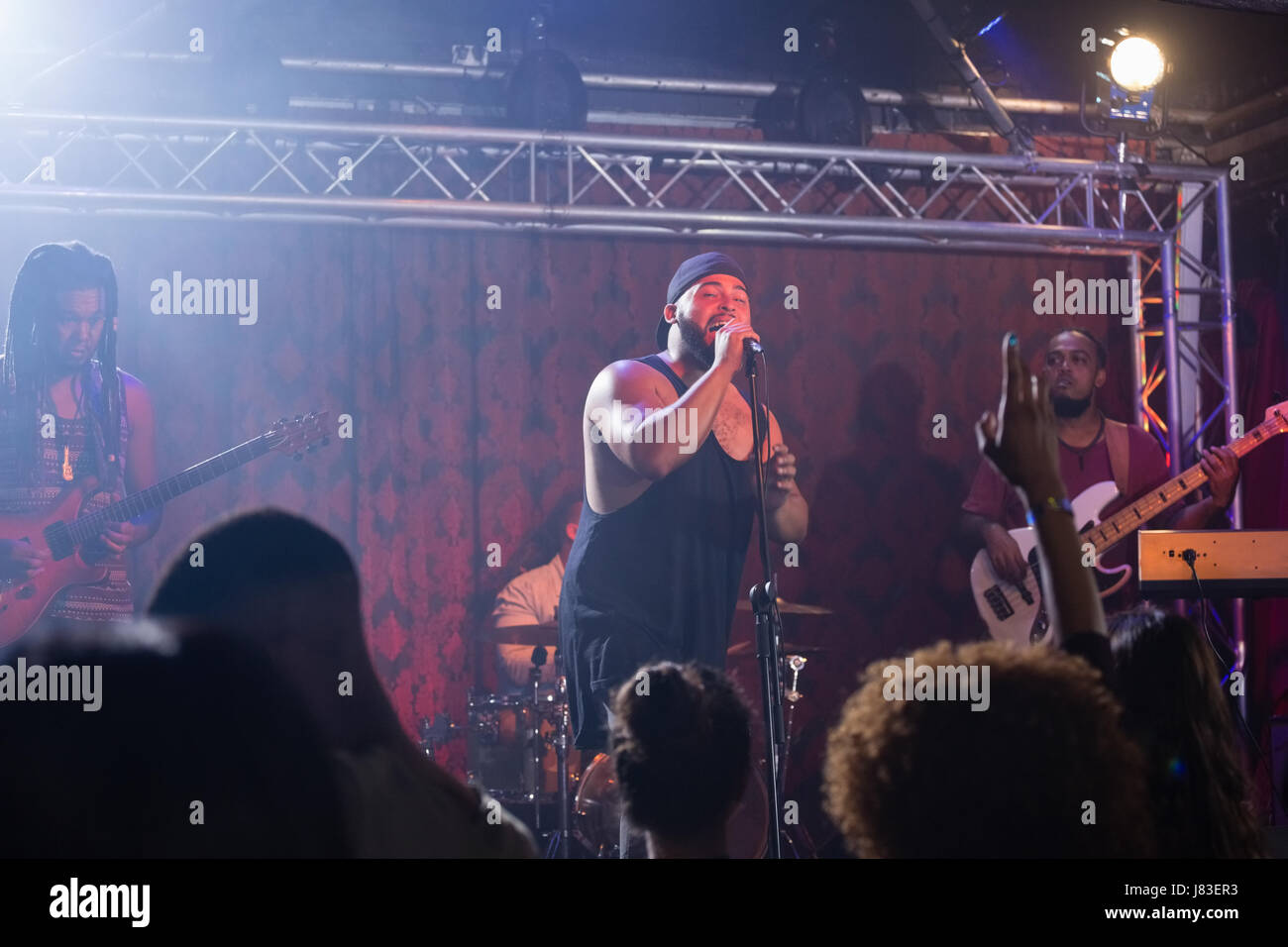 Singer performing on stage in nightclub Stock Photo - Alamy