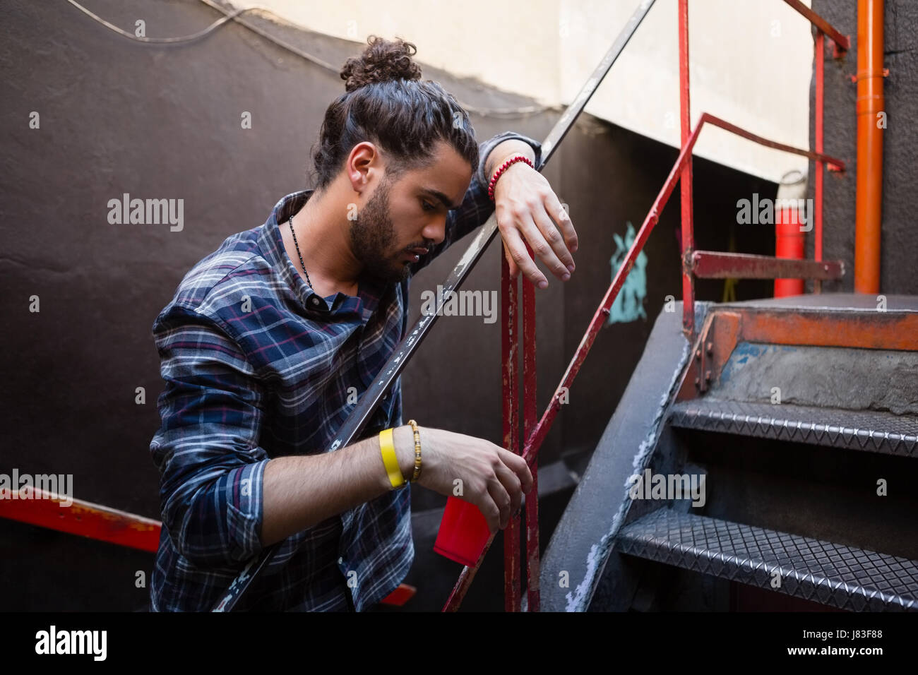 Man leaning railings hi-res stock photography and images - Alamy