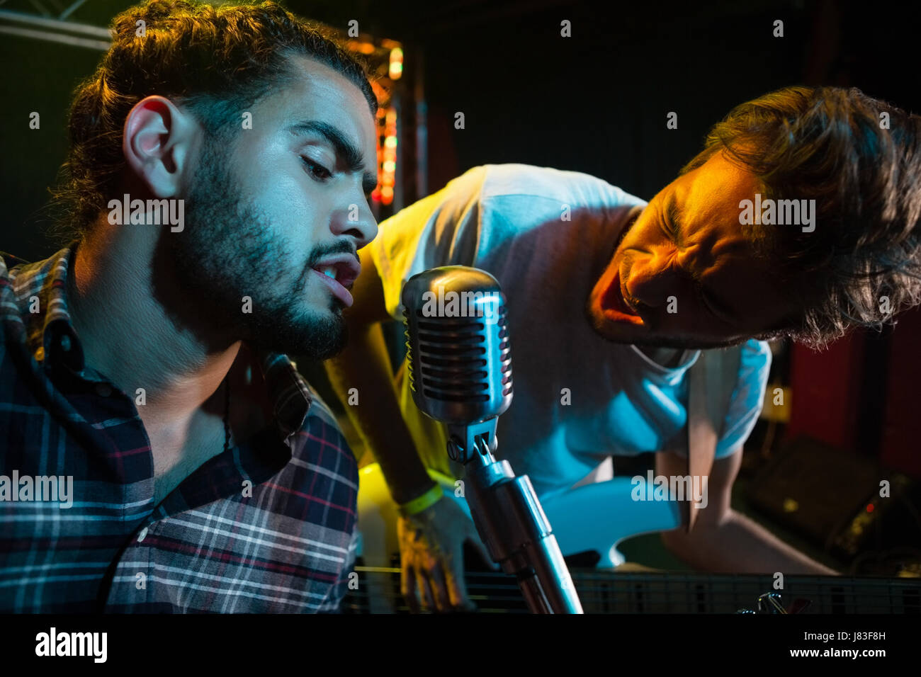Band performing on stage in nightclub Stock Photo - Alamy