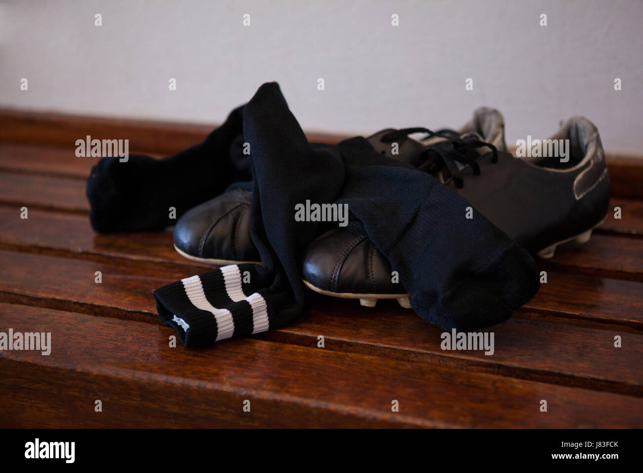 Close-up pair of shoes and socks on wooden bench Stock Photo - Alamy