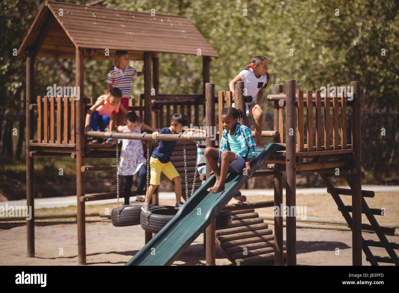 schoolkids playing in playground of school Stock Photo - Alamy
