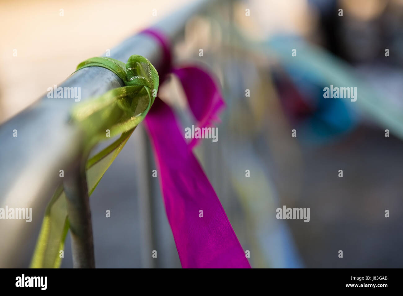 Decorative ribbons tied on a railing in the park Stock Photo - Alamy