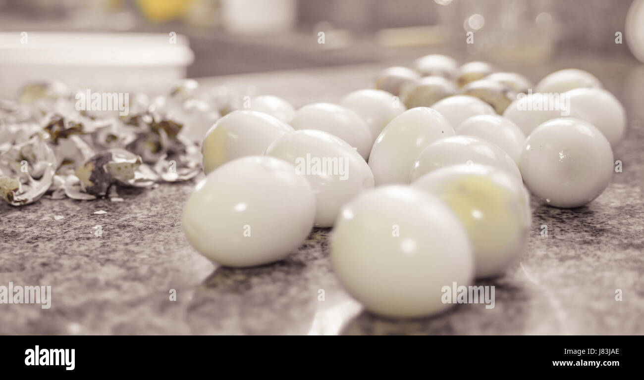 Quail eggs cooked without peel and some eggshell around Stock Photo - Alamy