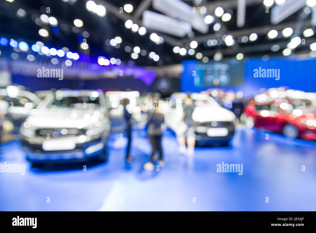 Blurred background of new car displayed in showroom. Car dealer Stock ...