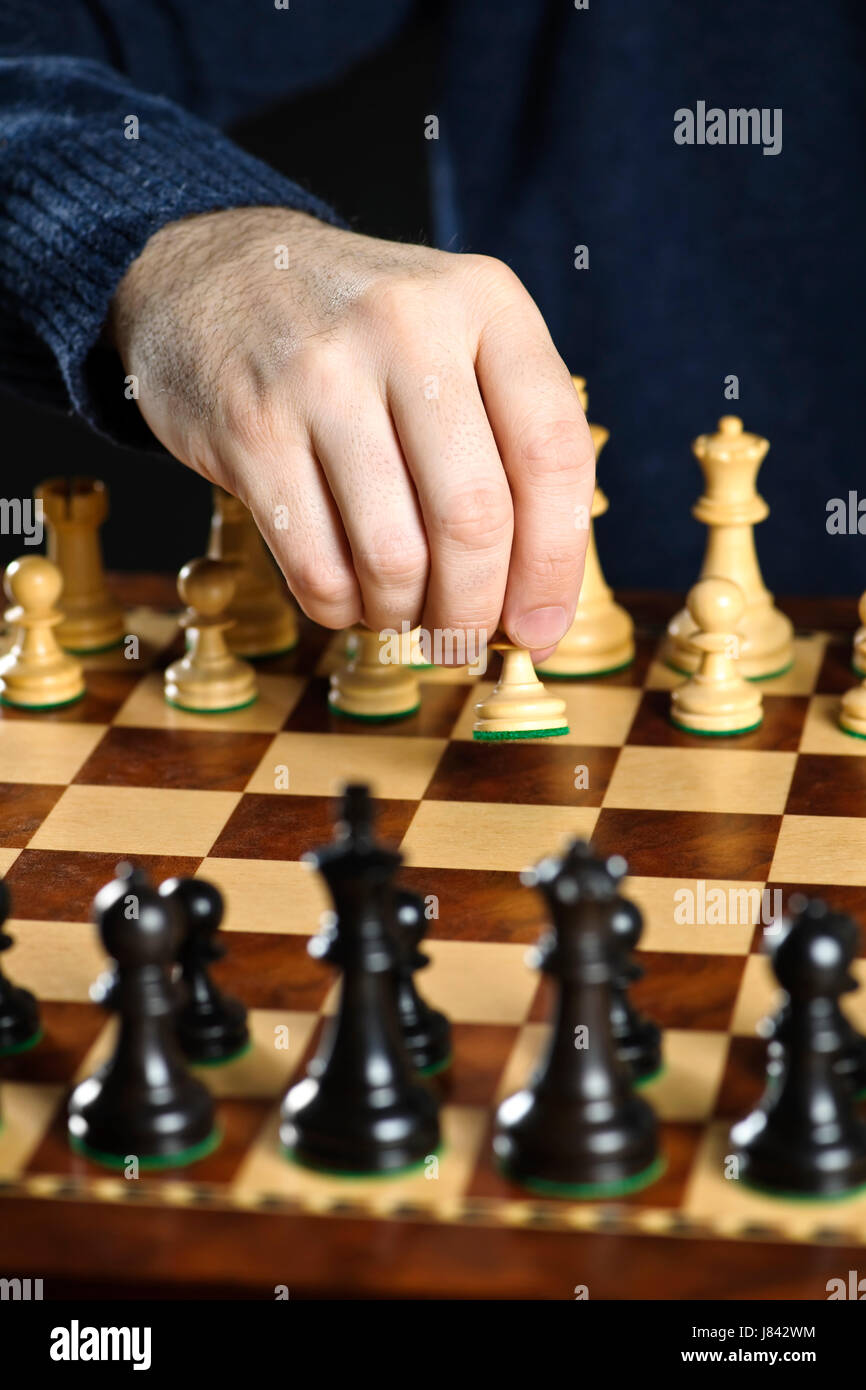 hand game tournament play playing plays played chess chessboard first ...
