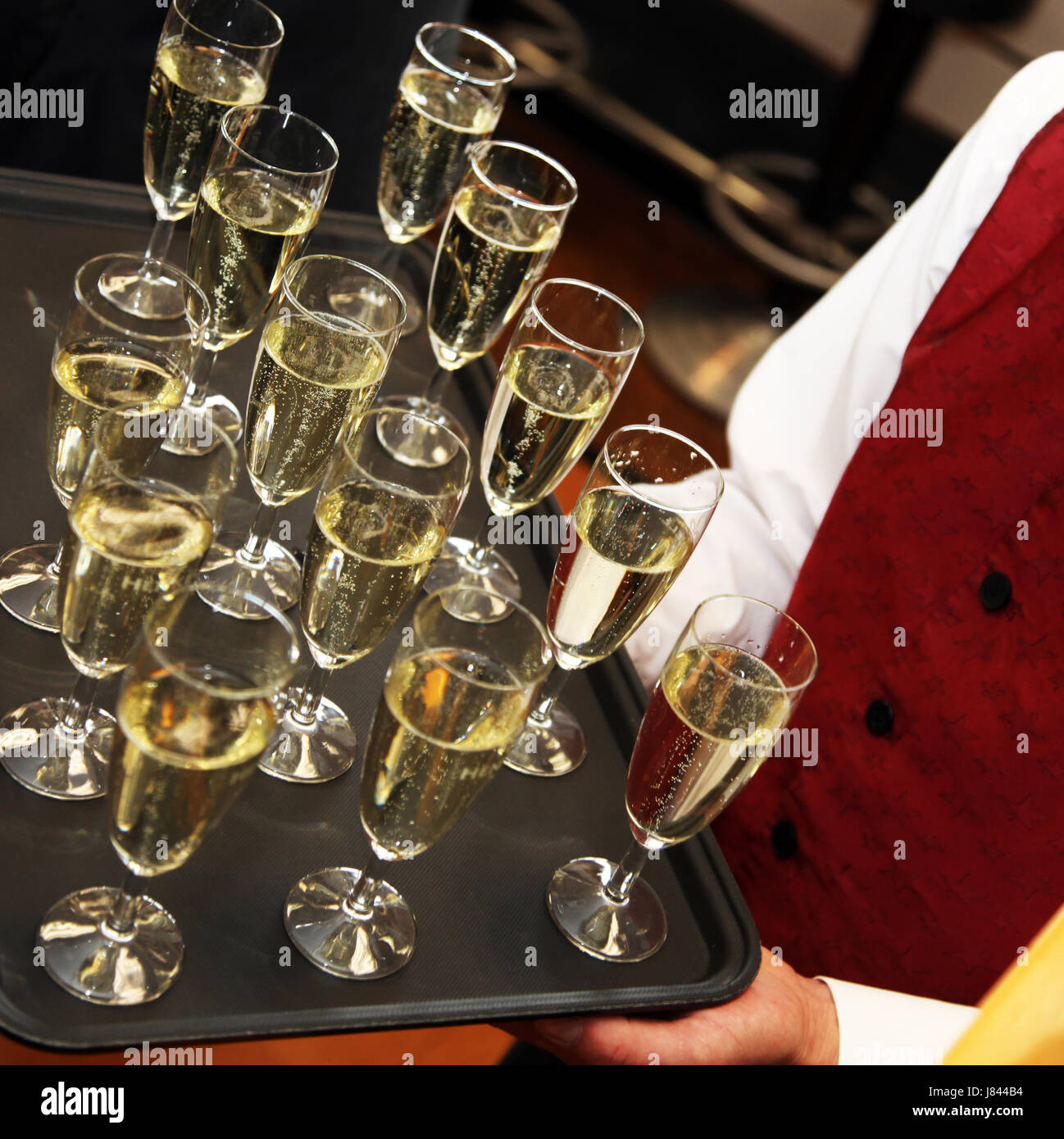 waiter serving champagne or champagne Stock Photo - Alamy