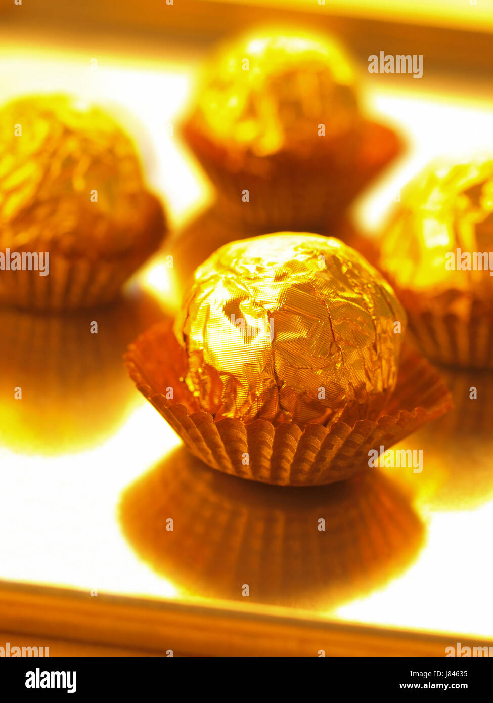 sweets candy calories wrapper dessert gold food aliment macro close-up ...