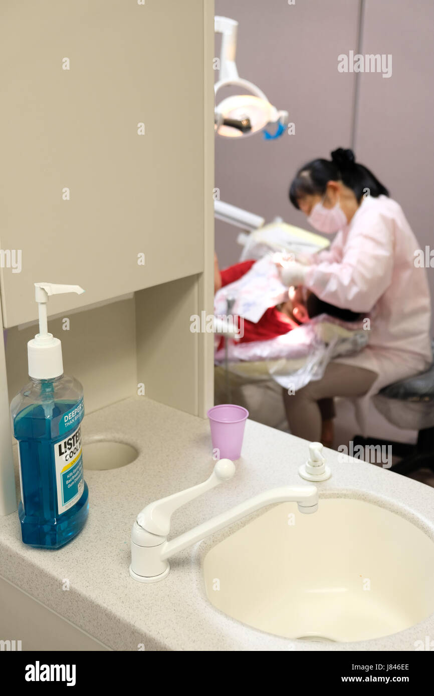 A young Asian boy got his teeth cleaned by a female dentist Stock Photo ...