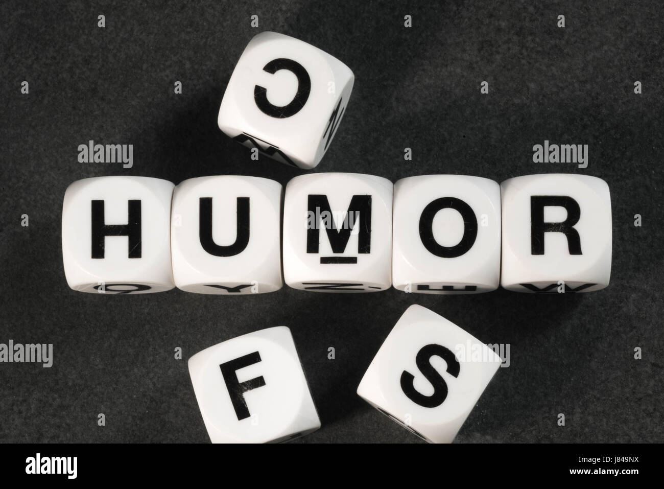 word humor on white toy cubes Stock Photo - Alamy