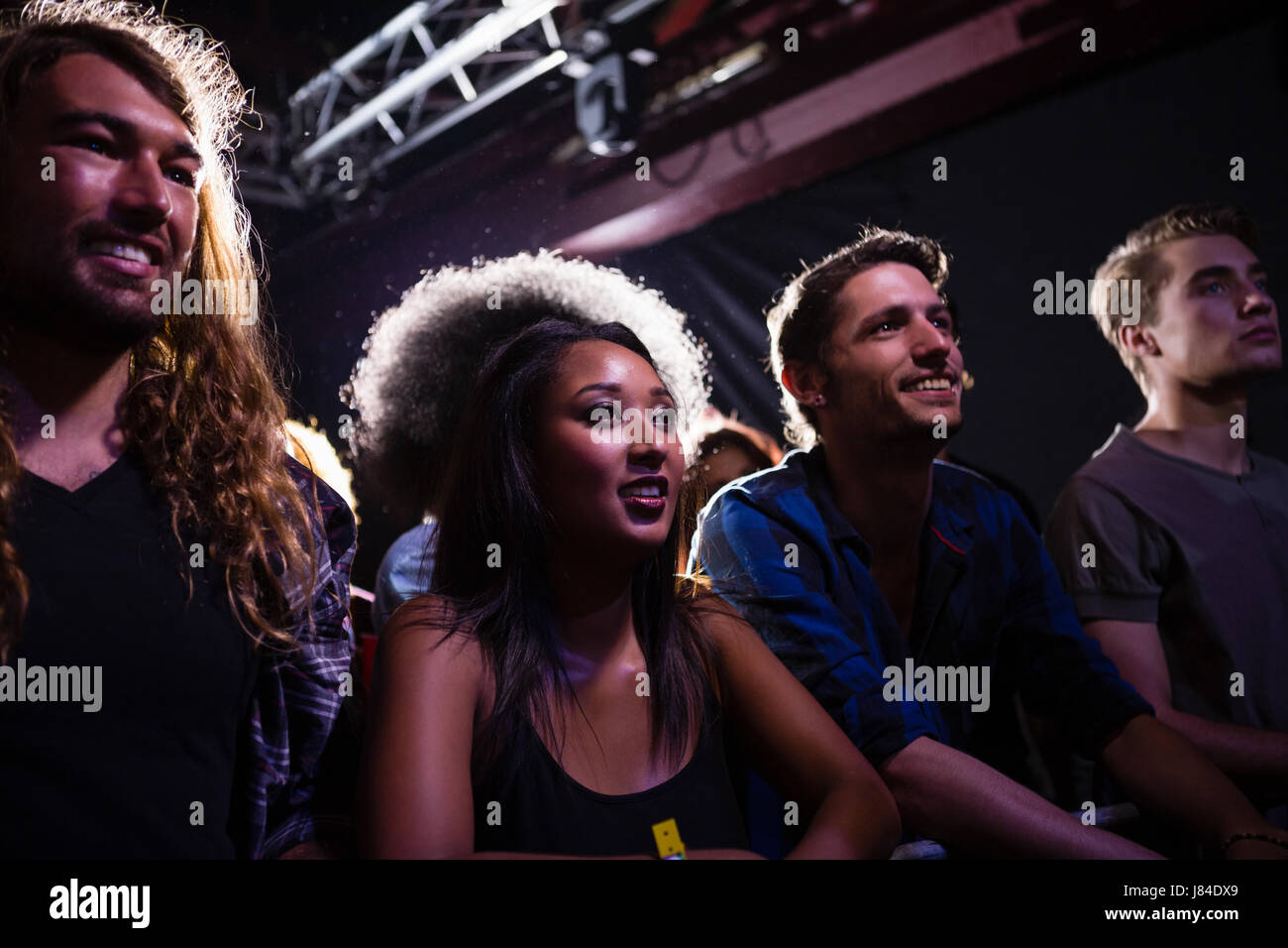 Group of friends watching a rock concert in nightclub Stock Photo - Alamy
