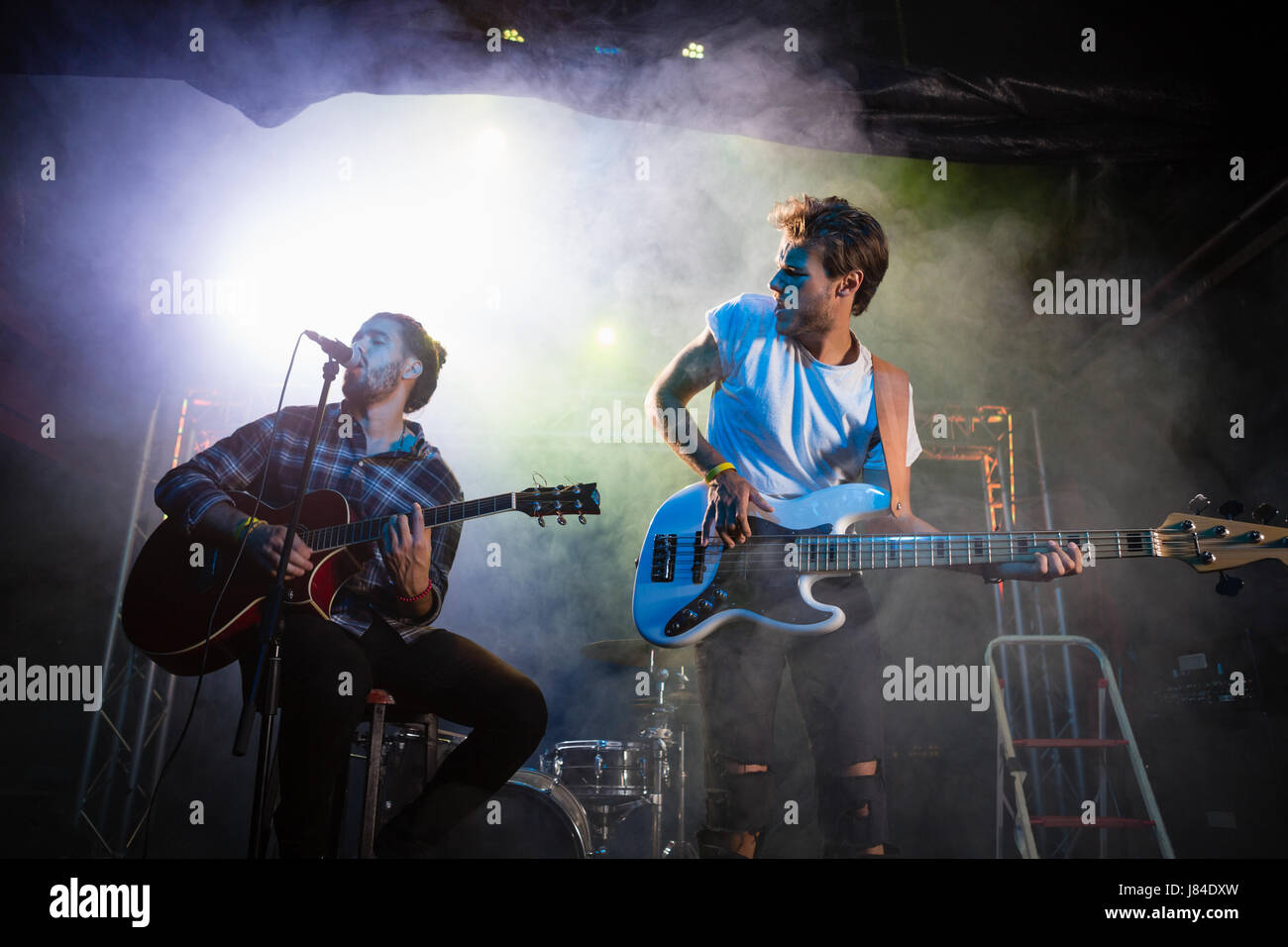 Band performing on stage in nightclub Stock Photo - Alamy