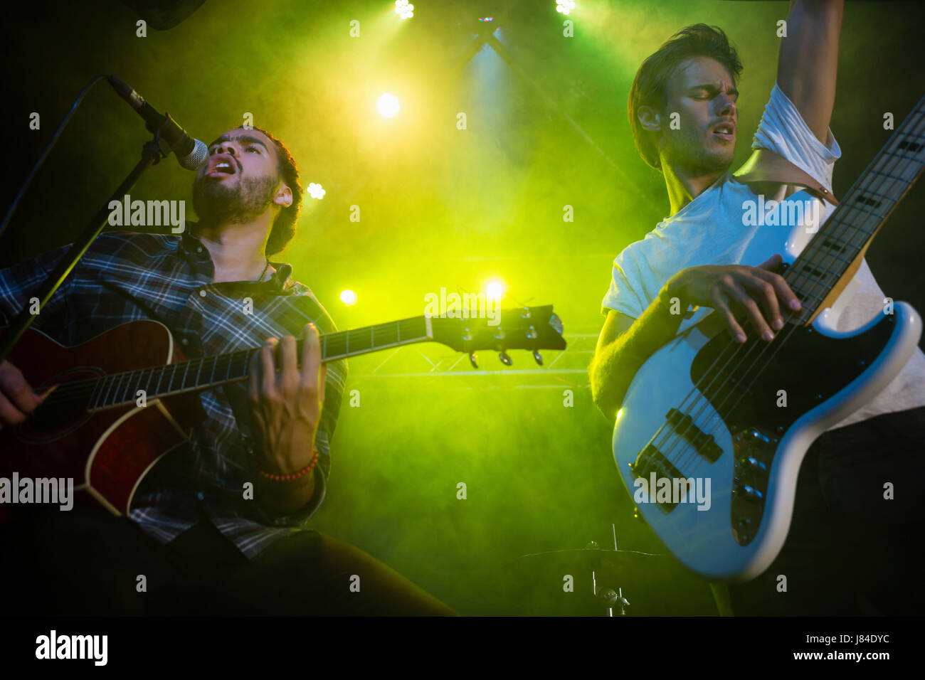 Band performing on stage in nightclub Stock Photo - Alamy