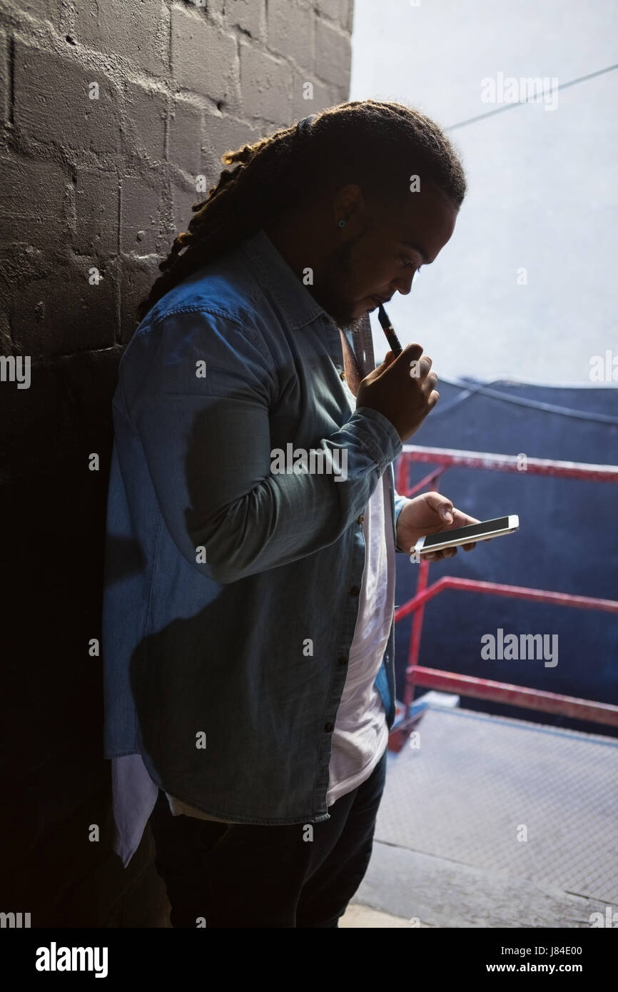 Mobile phone smoking cigarette hi-res stock photography and images - Alamy