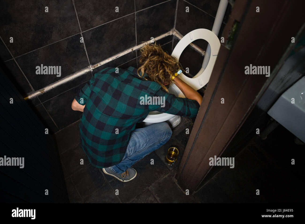 Man vomiting toilet hi-res stock photography and images - Alamy