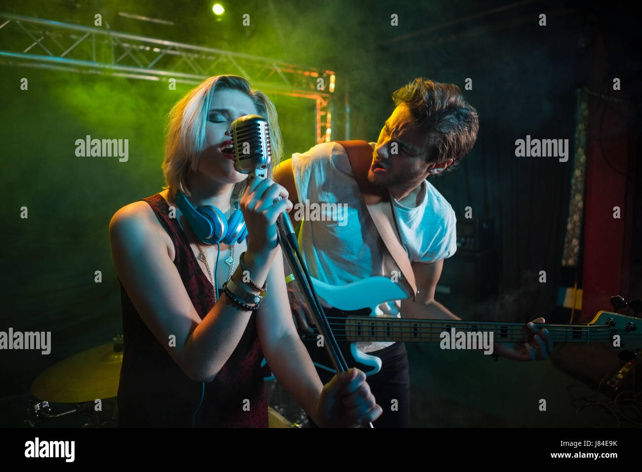 Band performing on stage in nightclub Stock Photo - Alamy