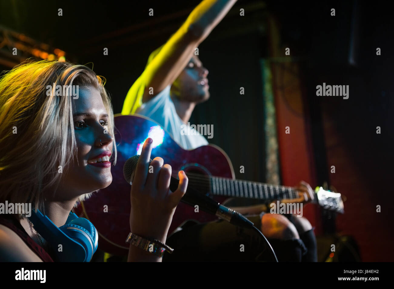 Band performing on stage in nightclub Stock Photo - Alamy