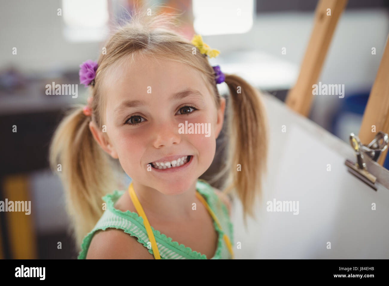 Portrait of smiling girl in school Stock Photo - Alamy
