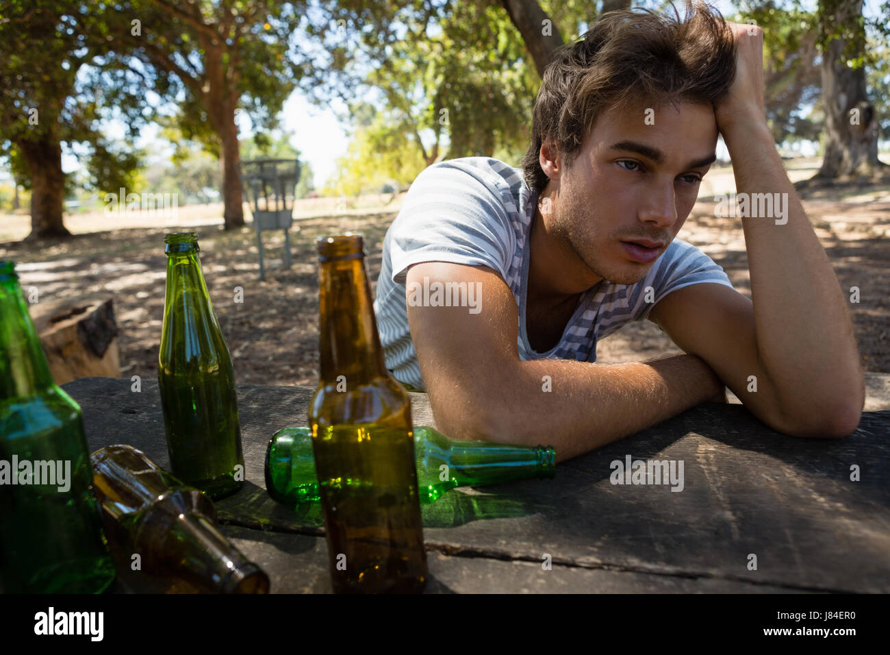 Unconscious drunken man relaxing in the park Stock Photo - Alamy