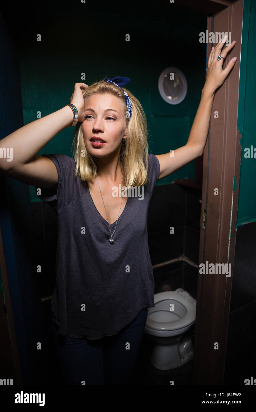 Unconscious drunk woman standing in the washroom Stock Photo - Alamy