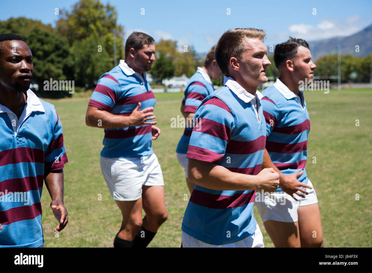 Team player jogging hi-res stock photography and images - Alamy