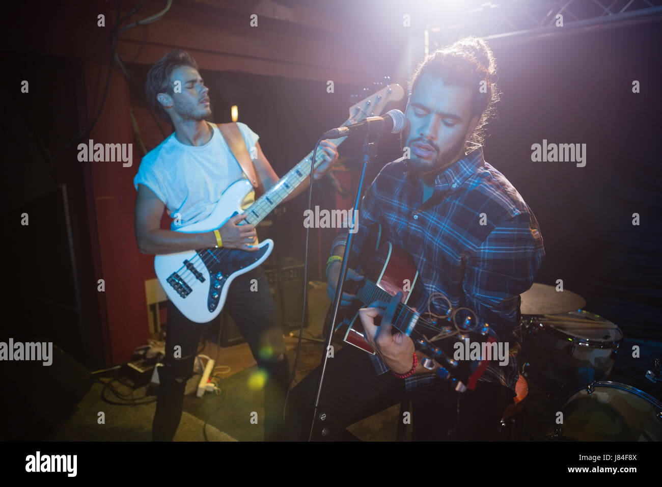 Band performing on stage in nightclub Stock Photo - Alamy