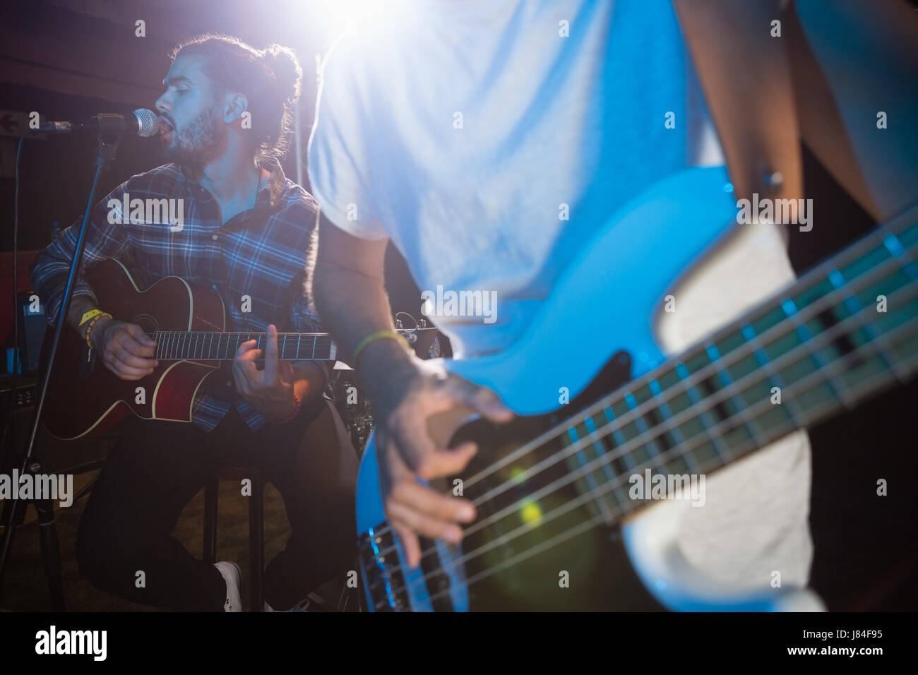 Band performing on stage in nightclub Stock Photo - Alamy