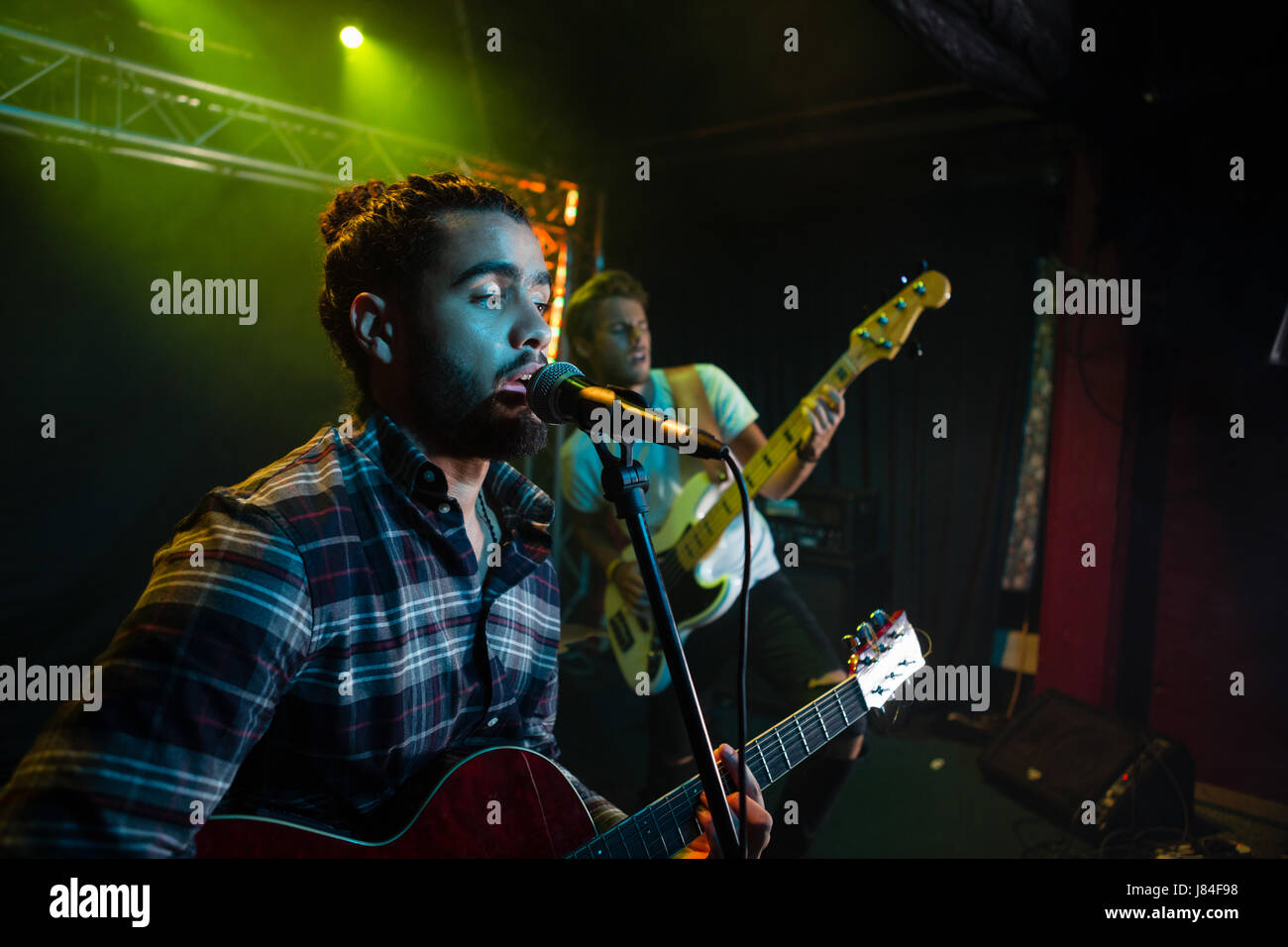 Band performing on stage in nightclub Stock Photo - Alamy