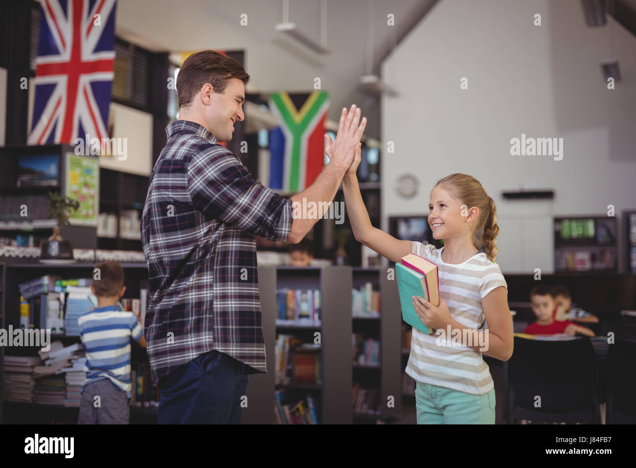 Child high five school hi-res stock photography and images - Alamy