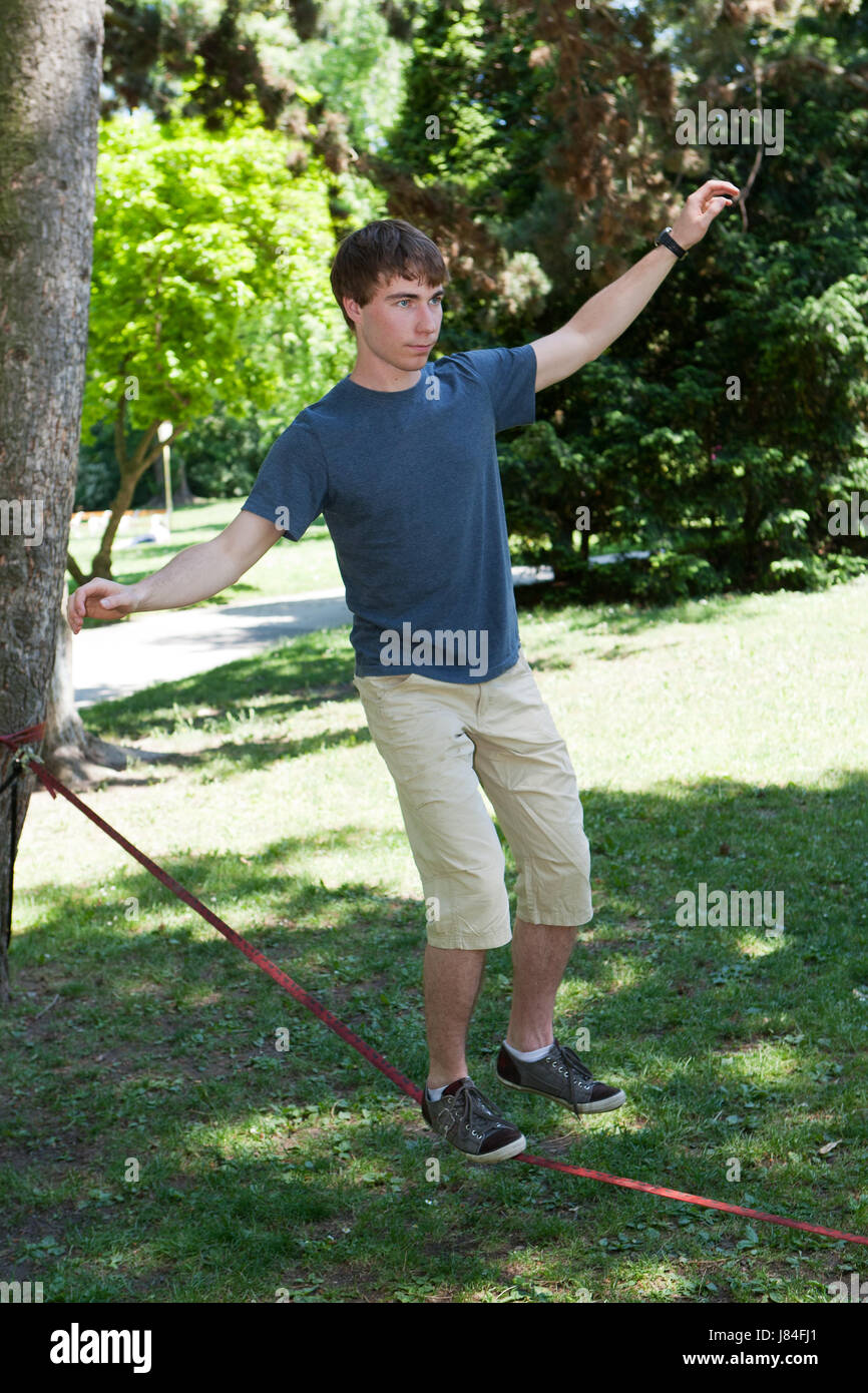 balancing on slackline Stock Photo - Alamy