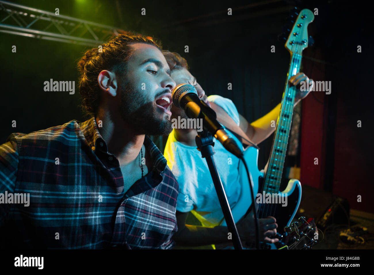 Band performing on stage in nightclub Stock Photo - Alamy